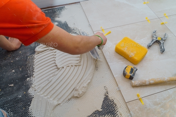 Applying new tiles on bathroom floor tile installation for house ...