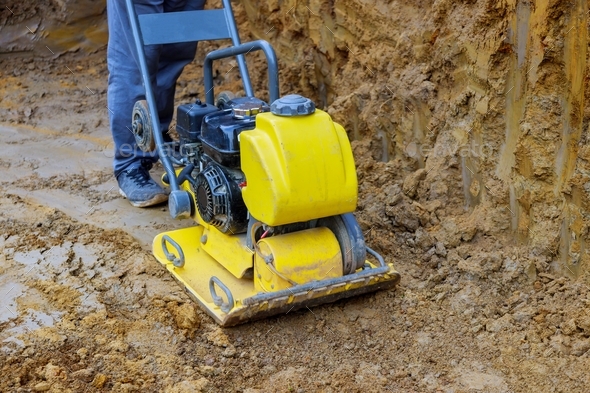 Vibratory plate compactor in construction rammer ground compaction of ...