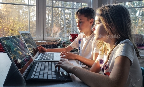 Kids with faces and emotions of concentration and focus using ...