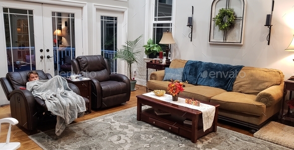 Generation z boy relaxing in chair at home before breakfast trying to ...