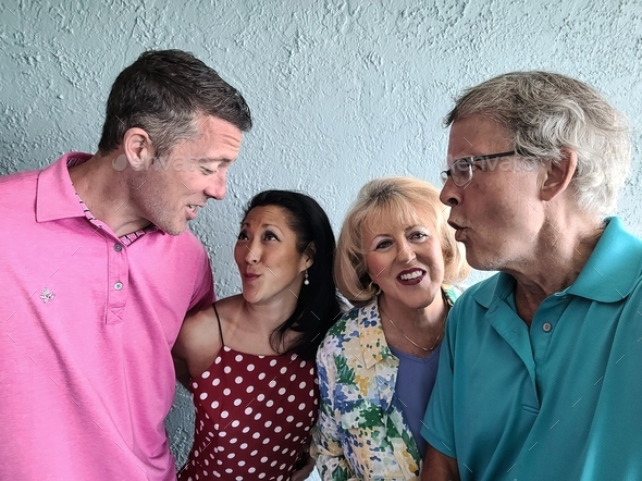 Senior parents on blue background with generation X kids in candid ...