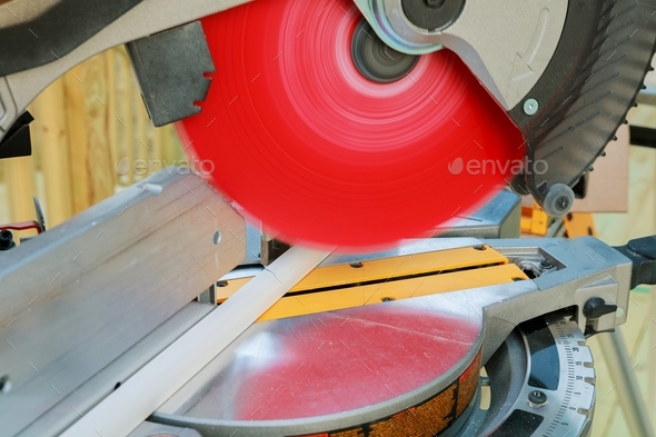 Man using saw to cut wood Man, worker sawing wood Stock Photo by photovs
