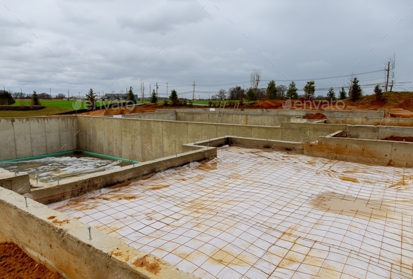 Apartment house in the foundation for a new building with cement Stock ...