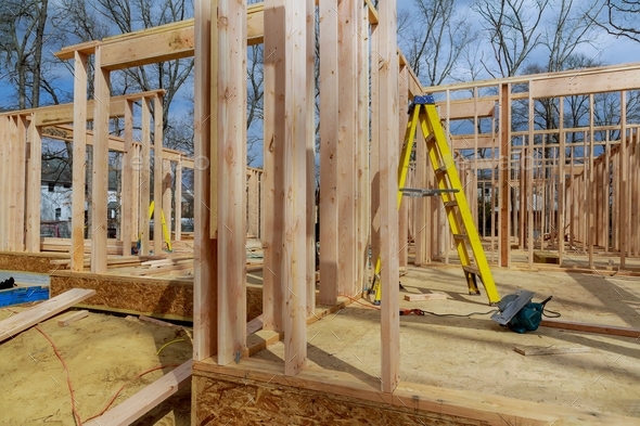 Framing of under construction wooden house building frame structure on ...