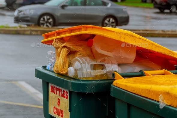 Overflowing garbage bins with household waste in the city Dumpsters ...