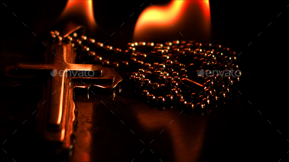 Christian Religion Symbol Cross on Fire Stock Photo by okanakdeniz