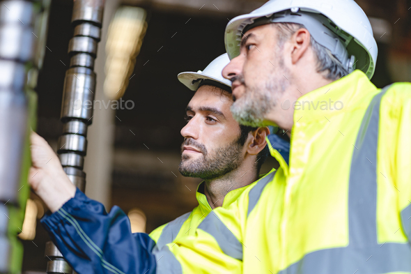 professional technician engineer with safety hard hat working to ...