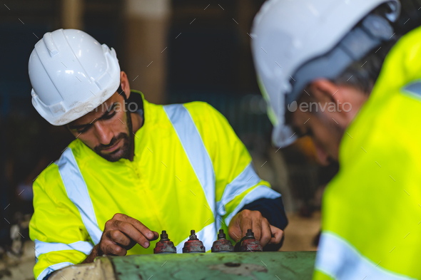 professional technician engineer with safety hard hat working to ...