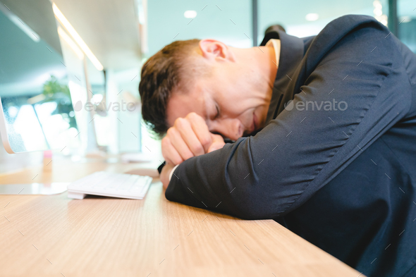 Tired and stressed office employee and manager resting and sleeping on ...