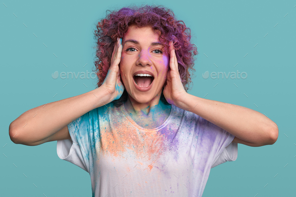 Excited woman in Holi colors in studio Stock Photo by kegfire | PhotoDune