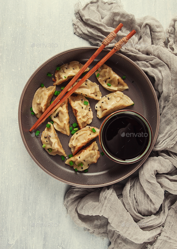 Japanese Gyoza dumplings,fried, with sauce, top view, without people ...