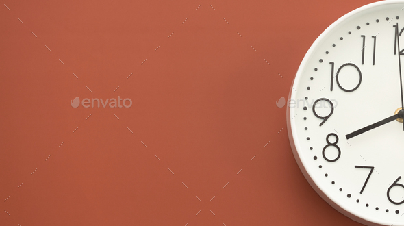 Clock on a red background, the concept of time management, time ...