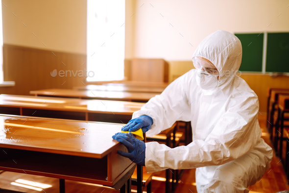 Cleaning and disinfection school desk during coronavirus pandemic ...