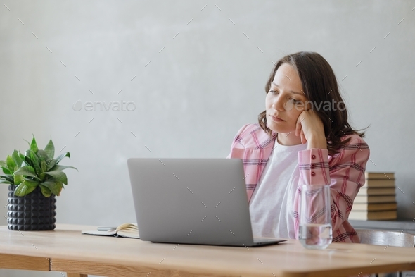 woman doing routine and monotonous boring work. Stock Photo by myjuly