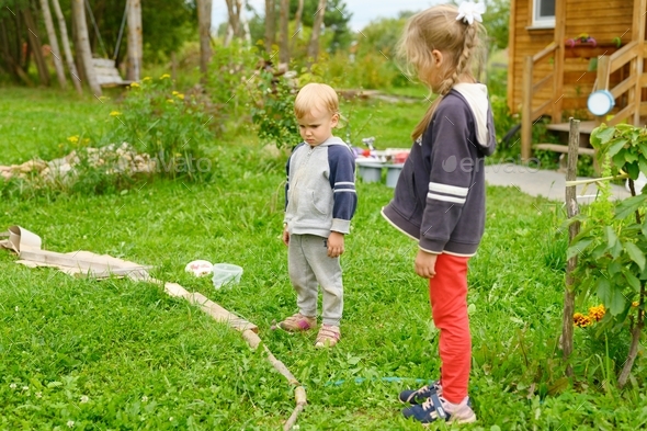 children playing outside, boy offended and sad Stock Photo by ksenia_she