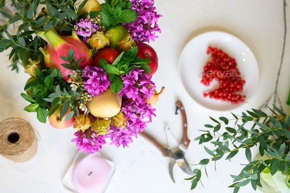 the process of make a fruit and flower bouquet. tutorial, do it ...