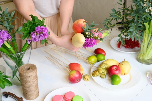 the process of make a fruit and flower bouquet. tutorial, do it ...