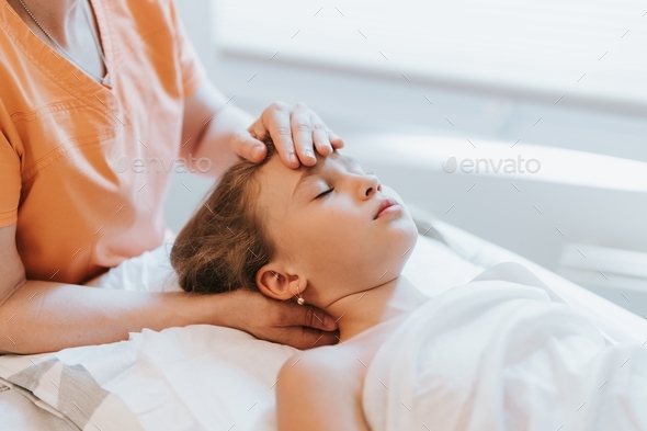 osteopath does therapy for kid girl. pediatric osteopathy treatment ...