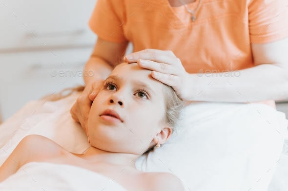 osteopath does therapy for kid girl. pediatric osteopathy treatment ...