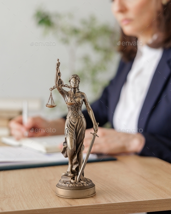 statuette of the goddess of justice. a symbol of honesty and decency ...