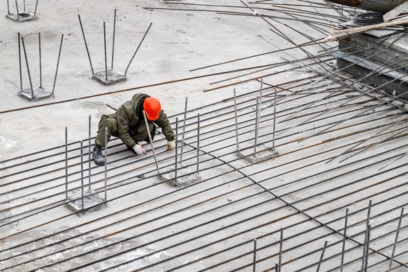 construction specialist makes a marking at the construction site of the ...