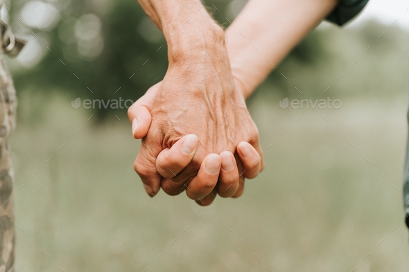 happy senior couple holding hands. hands of man and woman hold each ...