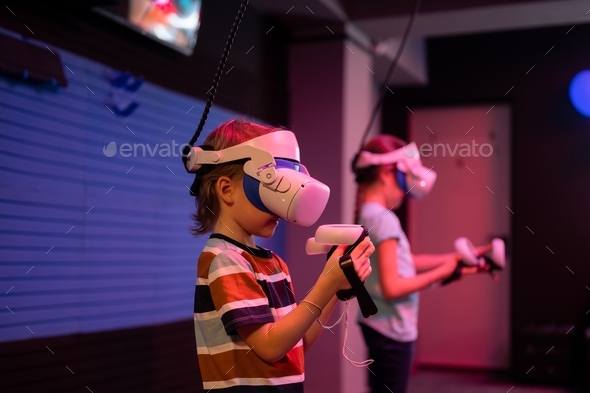 vr game and virtual reality. team kids friends gamers in 3d glasses ...