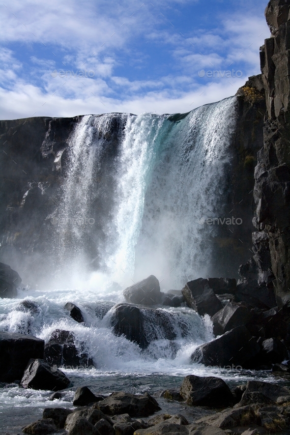 Waterfall in a part of the rift valley at Pingvellir caused by tectonic ...