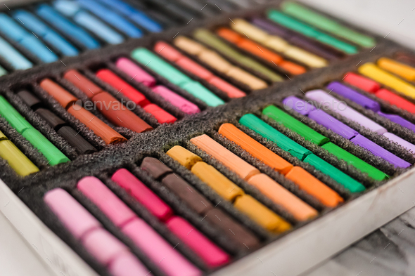 Multicolored artists soft pastels, chalks, crayons. Spectrum of colors ...