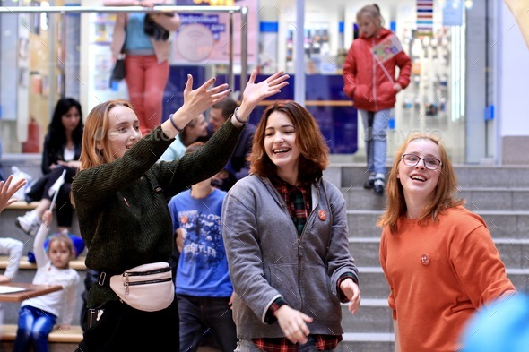 Gen Z. Children of different ages have fun at a holiday in the shopping ...