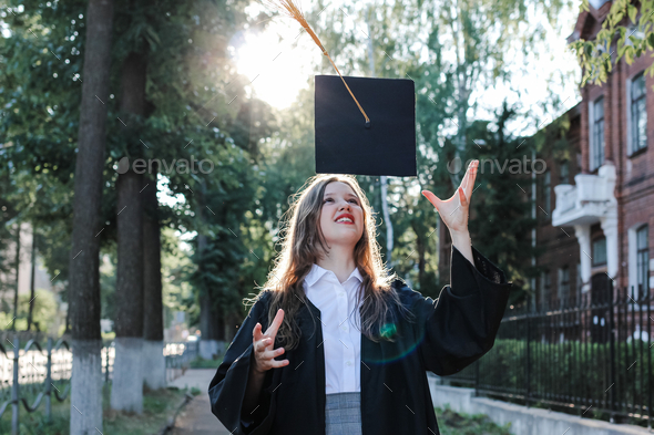 Cute teenage graduate girl laughing and having fun. No school, back to ...