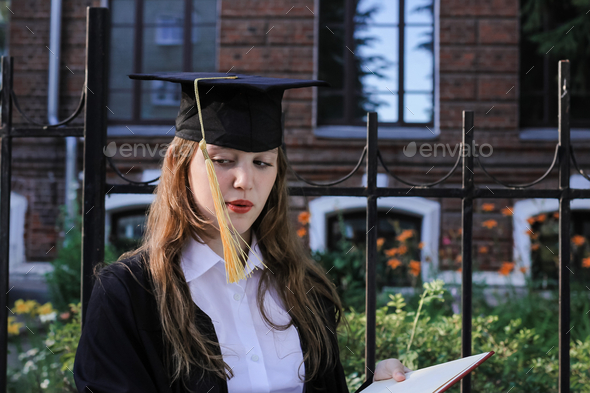 Cute teenage graduate girl laughing and having fun. No school, back to ...