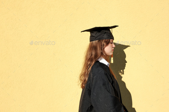 Cute teenage graduate girl laughing and having fun. No school, back to ...
