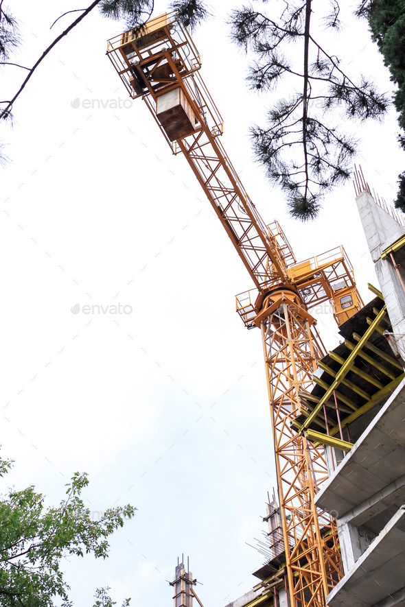 Construction crane stands on the background of the sky. Construction ...