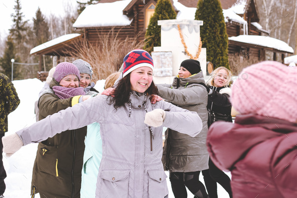 People having fun, dancing and singing on Russian ethnic carnival ...