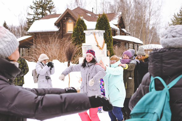 People having fun, dancing and singing on Russian ethnic carnival ...