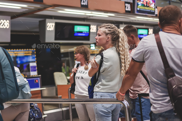 People at the airport. Diverse group of people. Passengers waiting for ...