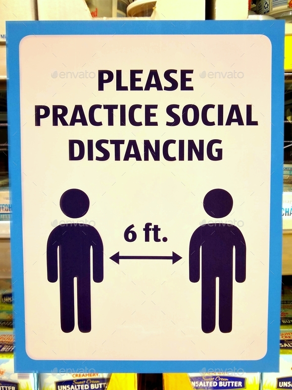 Sign on grocery store display with message Please Practice Social ...