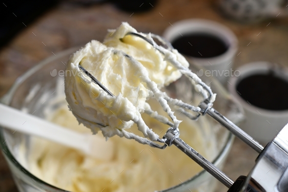 Homemade from scratch Buttercream icing frosting on the beaters of a ...