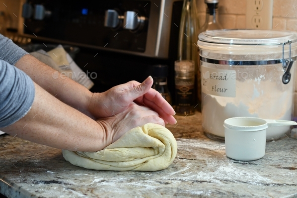 Making homemade bread - woman hands kneading bread dough on a kitchen ...