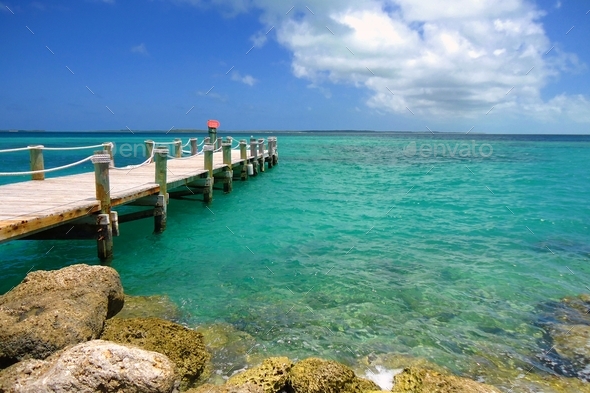 Pier into the turquoise waters of an island paradise in the Bahamas ...
