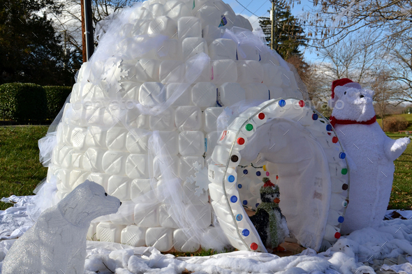 A white polar igloo Holiday display made out of milk jugs with polar ...