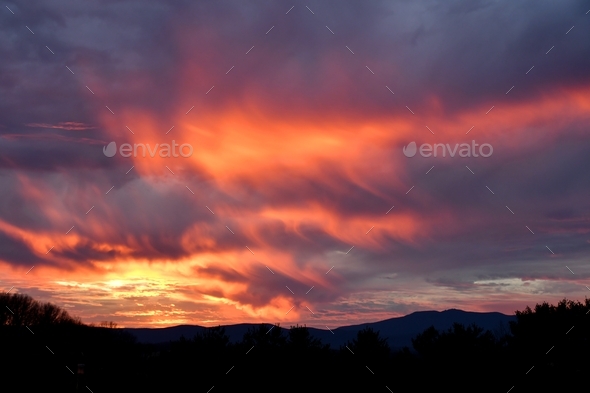 Stunning sunset sky with vibrant colors and wispy clouds over the ...