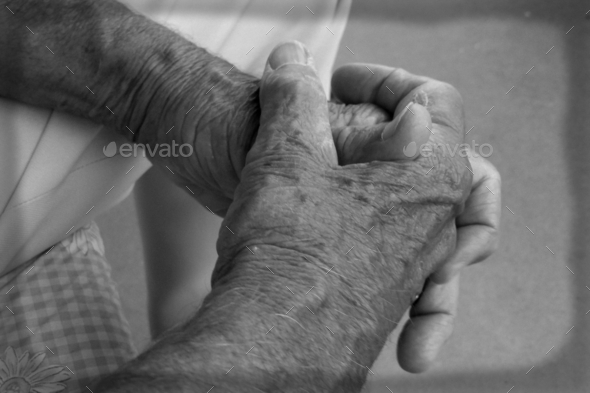The clasped hands of an older man, elderly, senior citizen, father ...