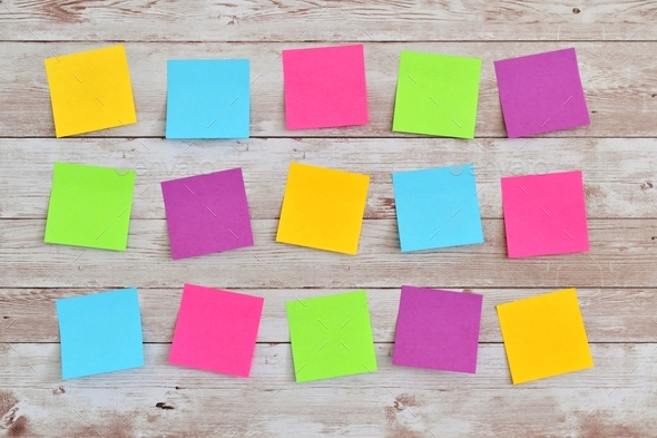 Blank copy space post-it sticky memo notes on a wall ready for messages ...