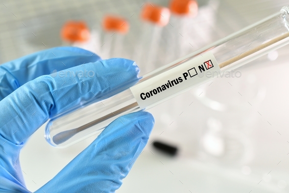 Testing swab in a test tube labeled coronavirus marked negative results ...