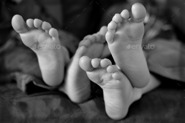 Blank and white of the bottom of children's feet. Twin boys toes. B&W ...