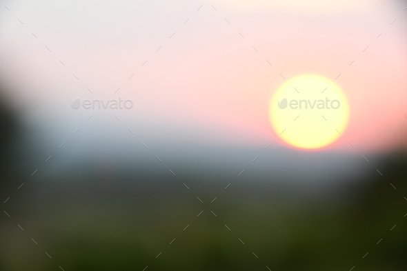 Out of focus sunset sunrise over the mountains for a natural neutral ...