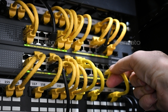 IT Department - cables wires connections to servers - IT guy making ...