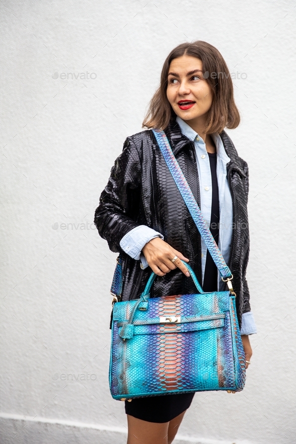 Street style of Woman with big leather bag. Stock Photo by mariiaplosh
